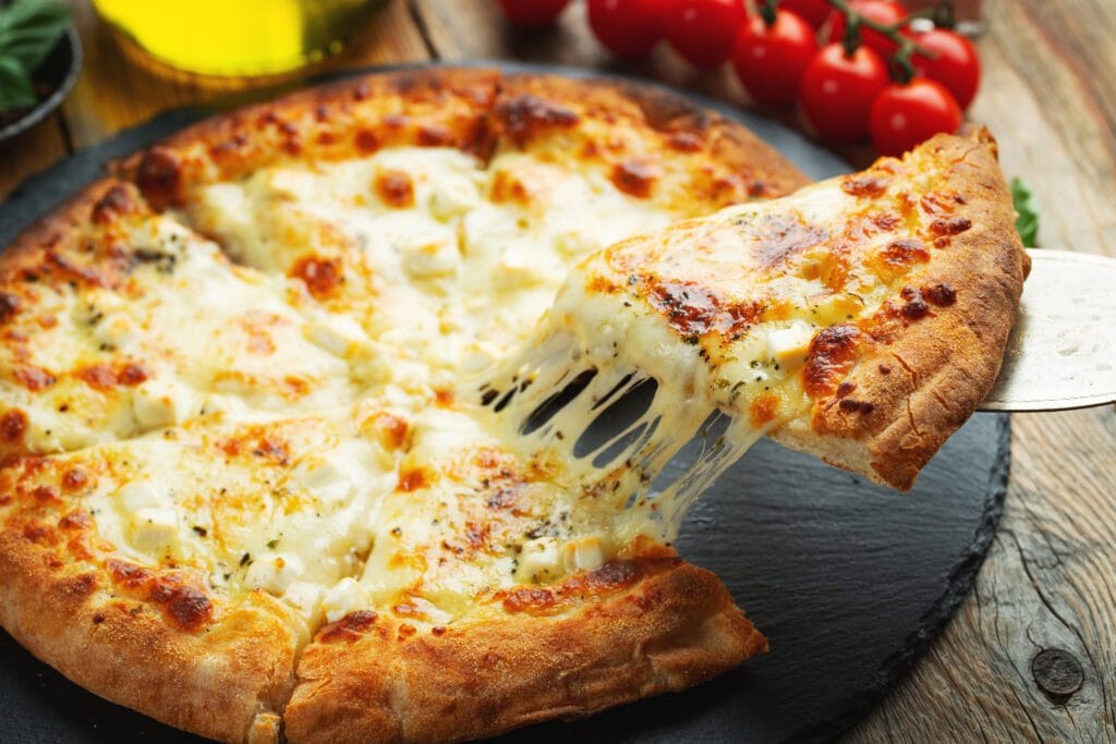Four Cheese Pizza Recipe: Creamy and Indulgent - platefulstory